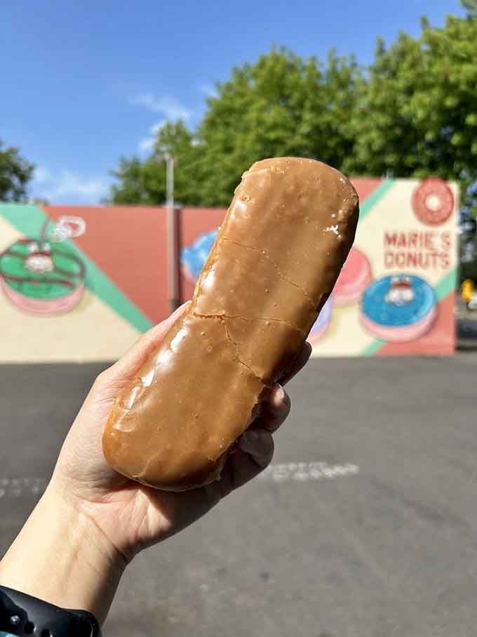 Behold the maple bar that launched a thousand cravings, glistening in the Sacramento sunshine like edible gold.