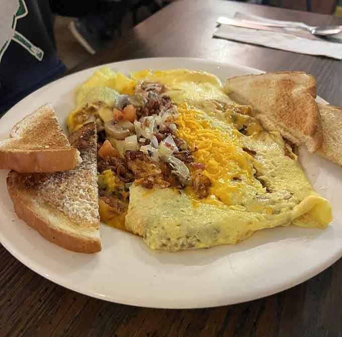 Brooke's Omelette arrives loaded with bacon, mushrooms, tomato, and cheddar. Brooke clearly has excellent taste.