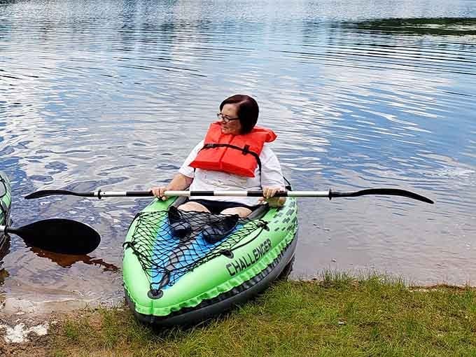 Nothing says pure joy quite like a bright green kayak, a life vest, and a lake that's all yours.