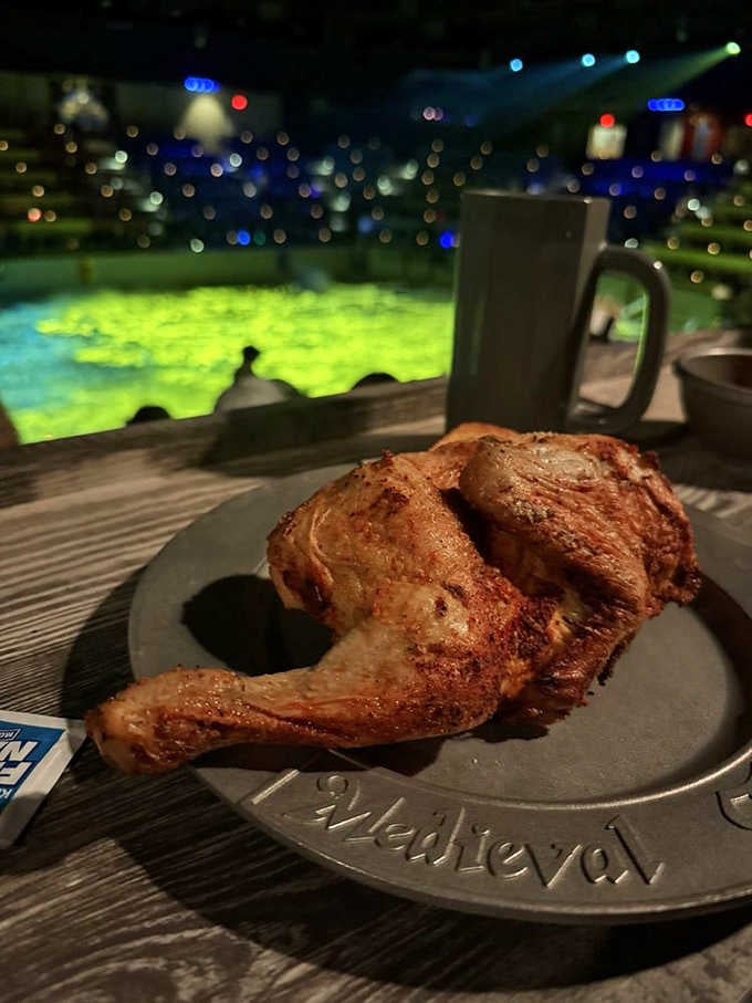 Half a roasted chicken, served on a pewter plate, with a jousting match as your dinner view.