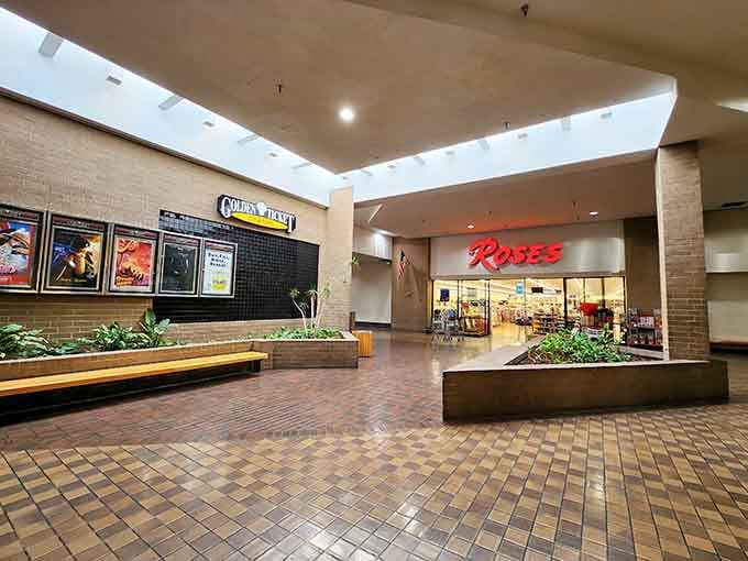 Roses department store and a movie theater sharing a mall corridor feels like a warm hug from 1987.