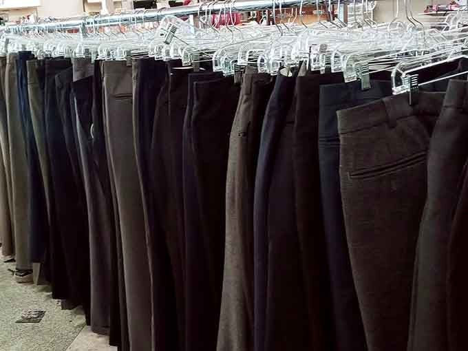 A rack full of trousers in every shade of serious, because looking sharp shouldn't cost a fortune.