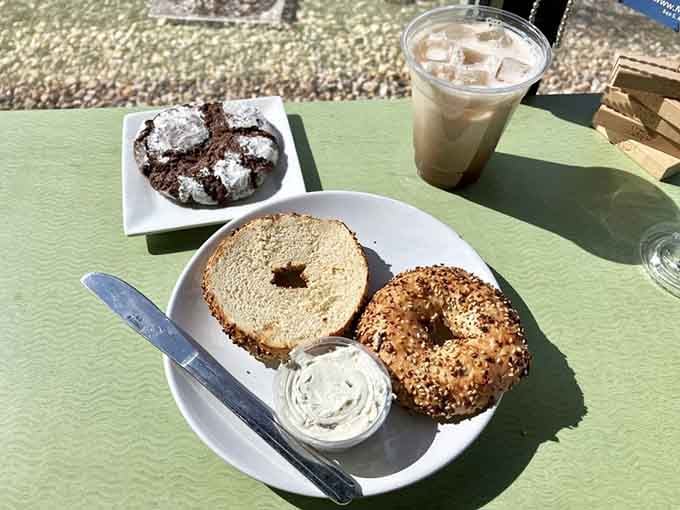 A seeded bagel with schmear, a chocolate crinkle cookie, and an iced coffee. This is what a perfect afternoon looks like.