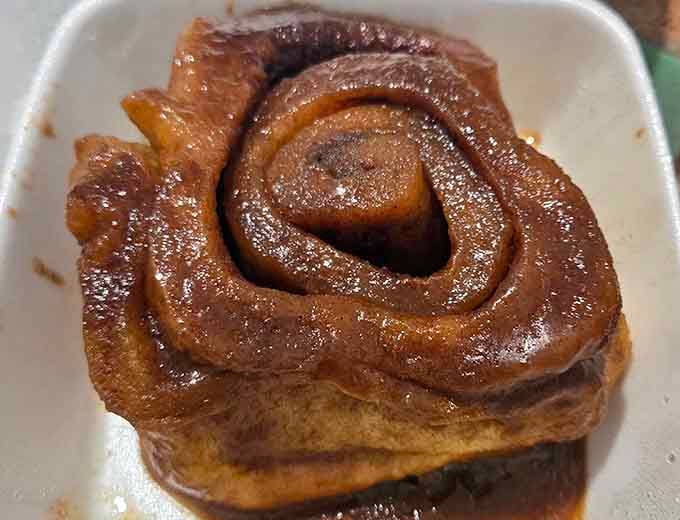 Glossy, caramel-glazed, and swirled to perfection, this sticky bun is the reason people set their alarms early.