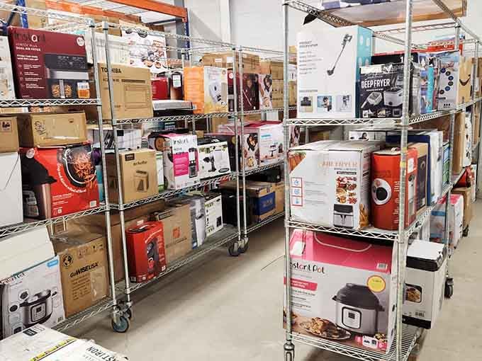 Air fryers, Instant Pots, and deep fryers stacked high, basically a kitchen upgrade waiting to happen.