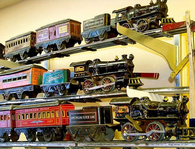 American Flyer trains lined up like old soldiers, still proud, still gleaming, still ready to roll down the track.