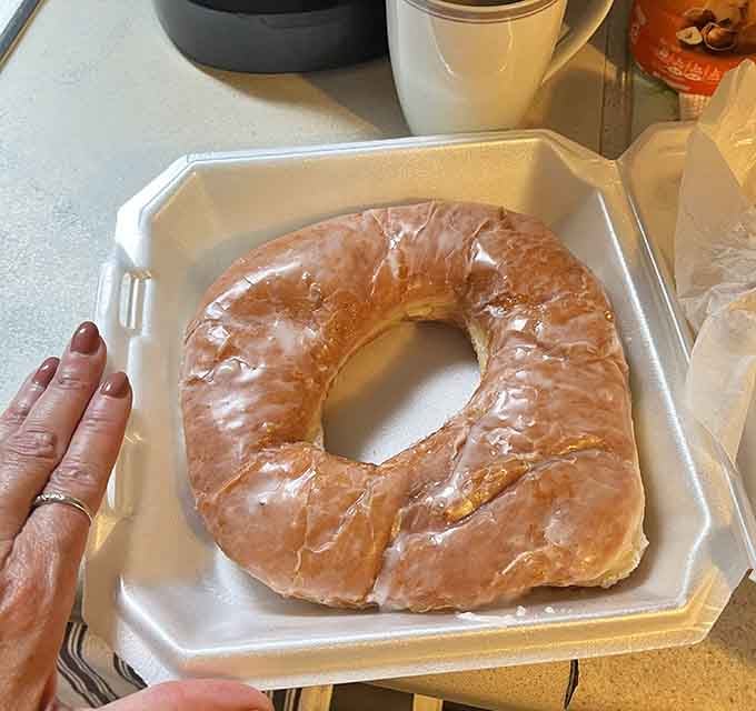 That glazed donut is so large it needs its own zip code. Bring your appetite and maybe a friend.