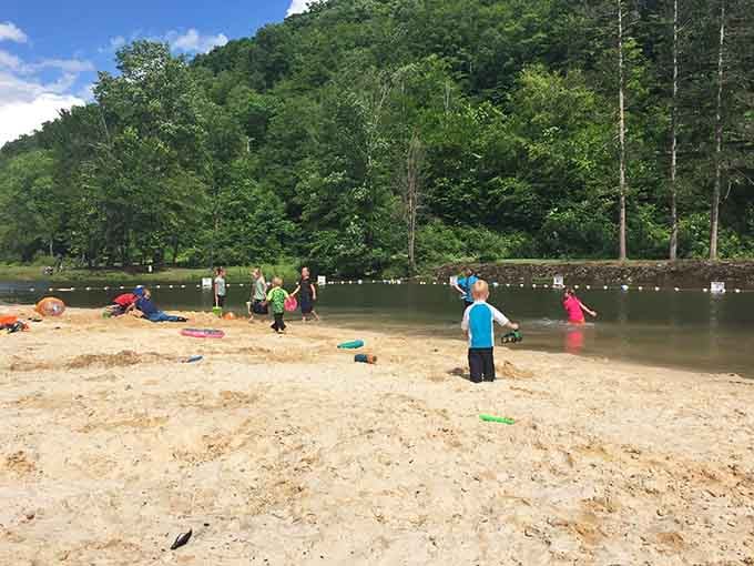 Sandy shores, splashing kids, and forested hills all around, this is what a perfect summer afternoon actually looks like.