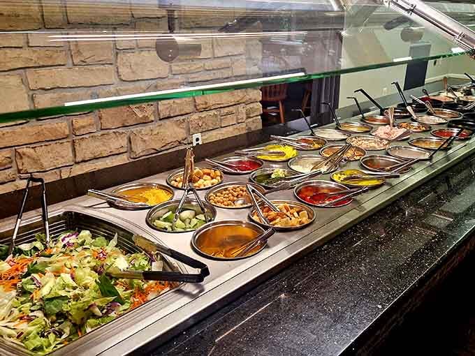 This salad bar isn't playing around, dozens of fresh toppings lined up like a delicious army ready for duty.