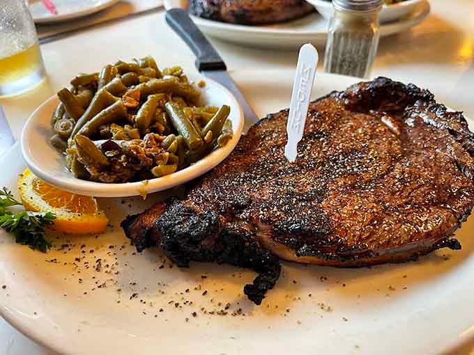 That ribeye arrives with a crust so beautifully seasoned, it deserves its own round of applause from the whole table.