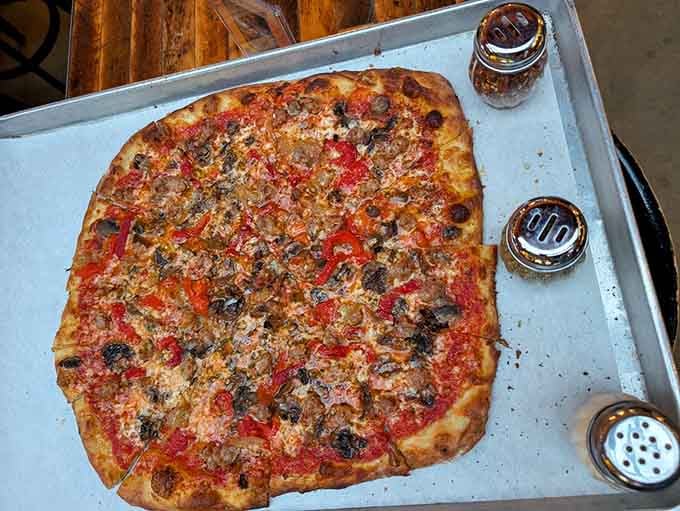 Hot Doug's Atomic Pizza brings serious heat, serious sausage, and a seriously good story to every single bite.