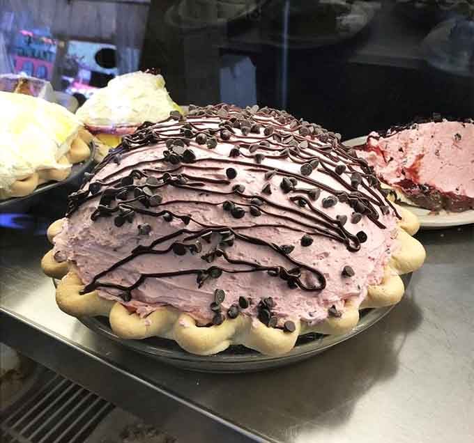 That pink cream pie with chocolate drizzle isn't just dessert. It's a reason to reroute your entire trip.