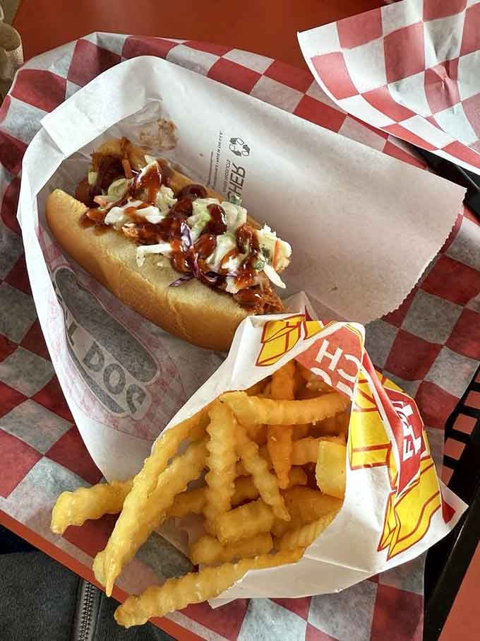 Pulled pork piled high on a bun with slaw and crinkle fries. Tuesday just got interesting.