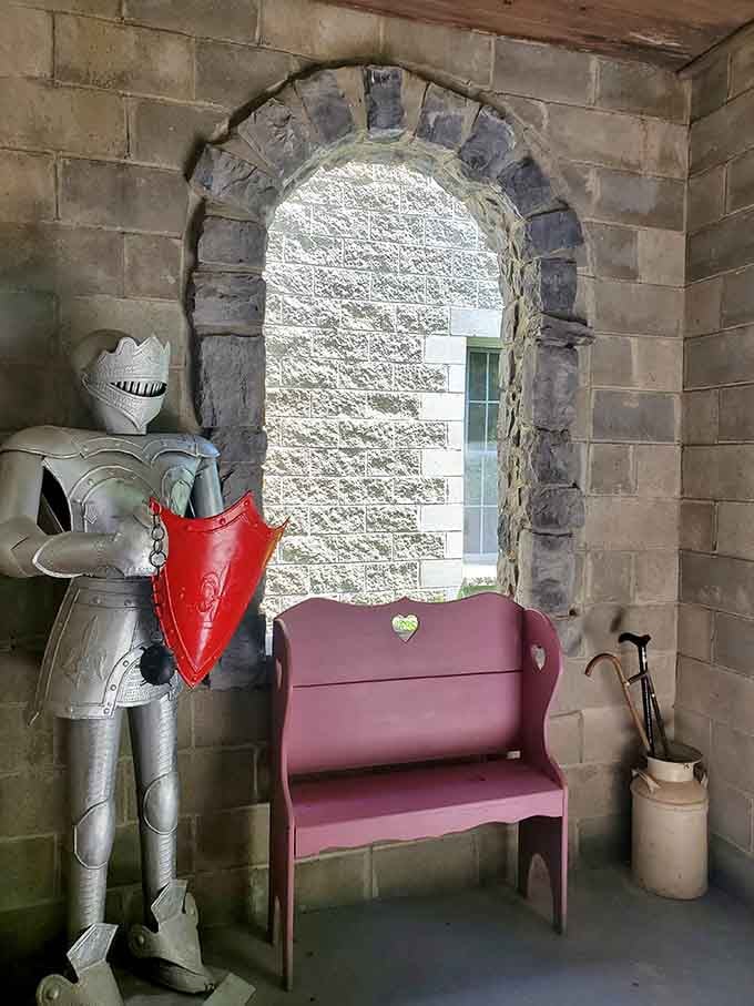 Even the hallways commit to the bit with full armor displays that would make museum curators jealous.