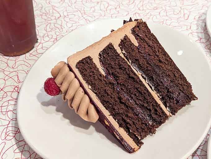 Layers of chocolate cake so tall and proud, it deserves its own theme music upon arrival.