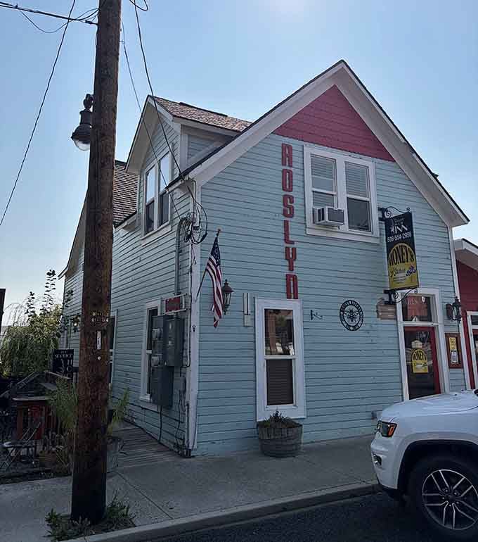 The light blue exterior of this charming corner building practically shouts "Roslyn" in big red letters, and honestly, same.