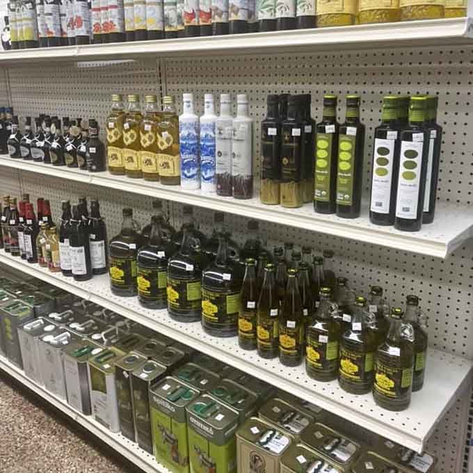 Olive oil bottles lined up like liquid gold soldiers, ready to transform your salads from sad to spectacular.
