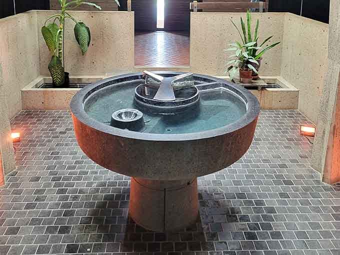 Even the baptismal font looks like it could be featured in Architectural Digest, proving holy water deserves a stylish home too.