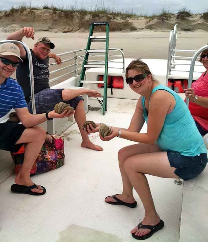 The smiles on this boat say everything. Nothing bonds strangers faster than holding something the ocean made millions of years ago.