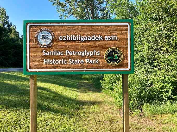 The park sign reads "ezhibiigaadek asin," meaning "the rock that is written on." That's a pretty good description.