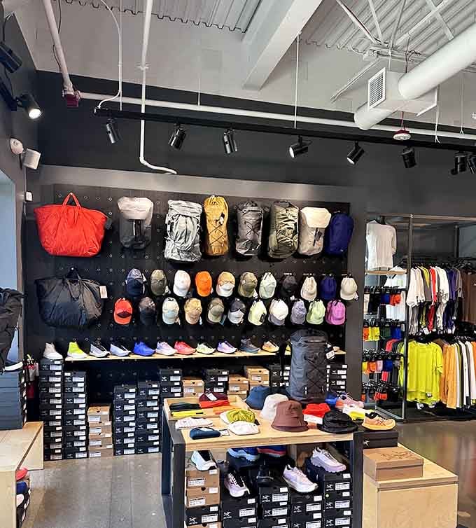 Backpacks, trail shoes, and caps stacked floor to ceiling. Outdoor enthusiasts, consider this your personal paradise.