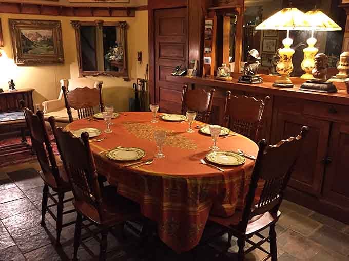A dining table set this beautifully in a room this warm makes you want to sit down and never discuss leaving.