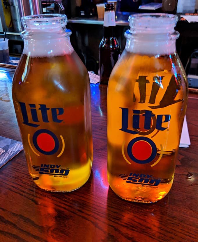 Miller Lite served in Indy 500 bottles, because in Indianapolis, even your beer knows how to dress for the occasion.