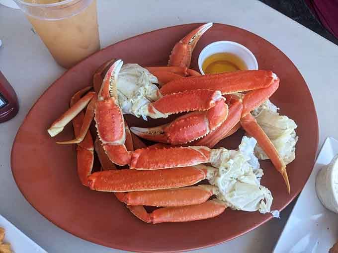 A mountain of snow crab legs with melted butter on the side. This is not a meal. This is a commitment.