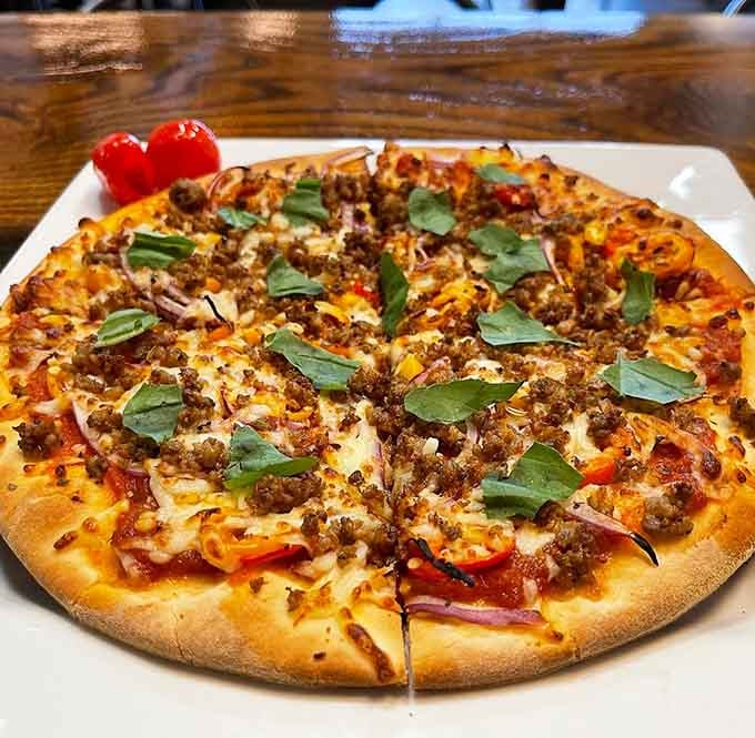 Flatbread loaded with sausage and fresh basil proves simple ingredients can create extraordinary results every single time.