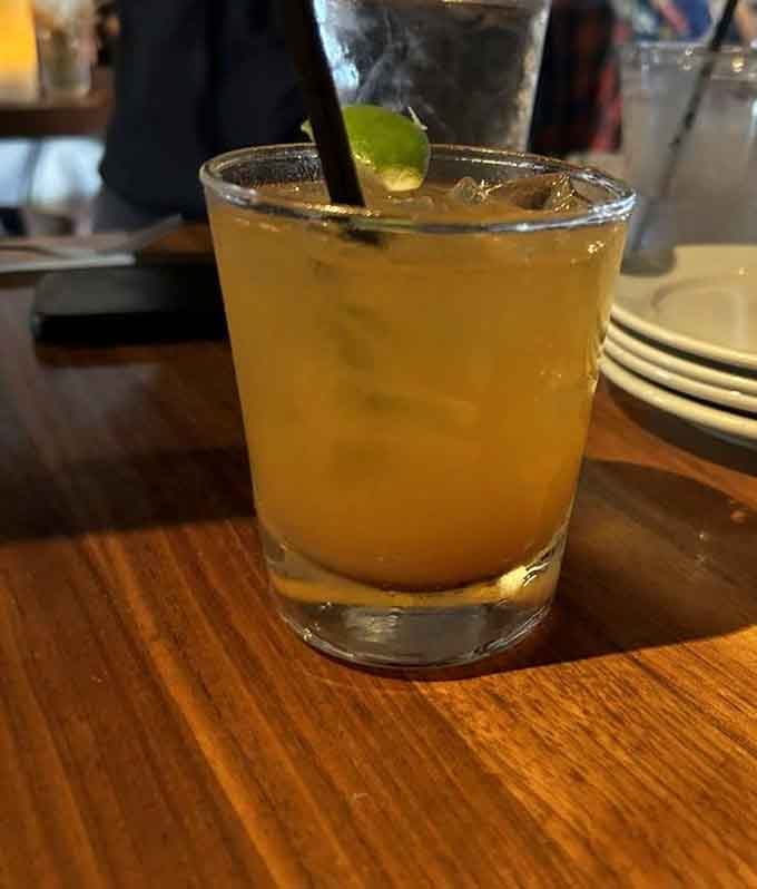 Golden, icy, and garnished with lime, this cocktail looks like a summer afternoon decided to show up in a glass.