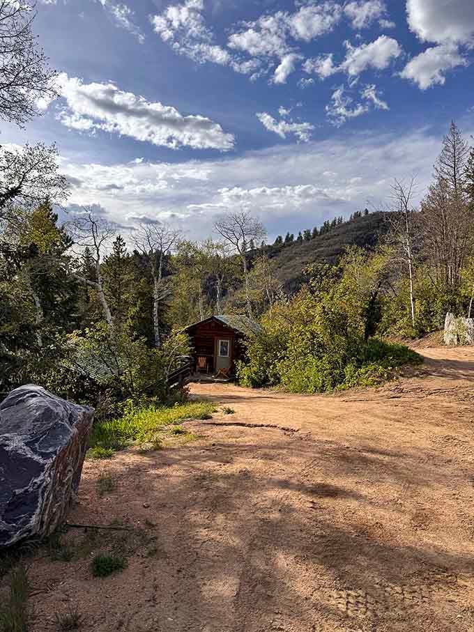 A rustic cabin tucked into the mountain dirt, proof that the best addresses don't always come with a zip code.