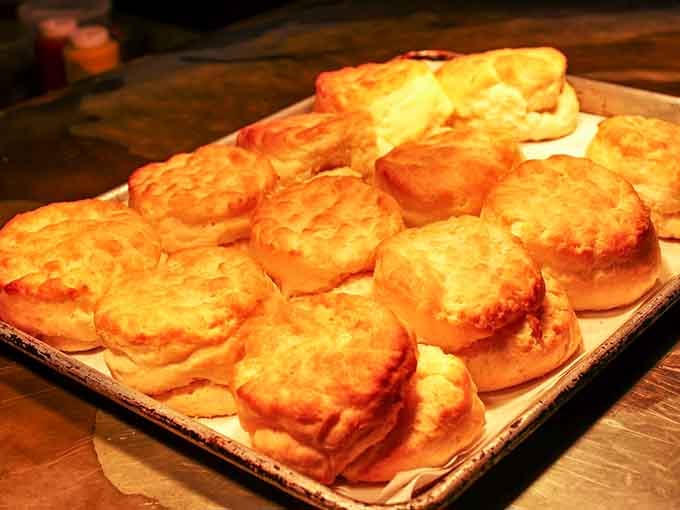 Golden, fluffy, and stacked on a tray like little edible treasures, these biscuits are the reason road trips were invented.