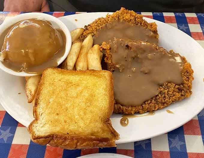 Golden, crunchy, smothered in brown gravy, and served with toast and fries. This chicken-fried steak means serious business.