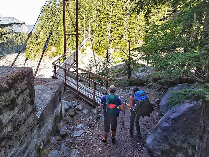 Nothing says adventure quite like following fellow hikers toward a swaying bridge over rushing glacial water.