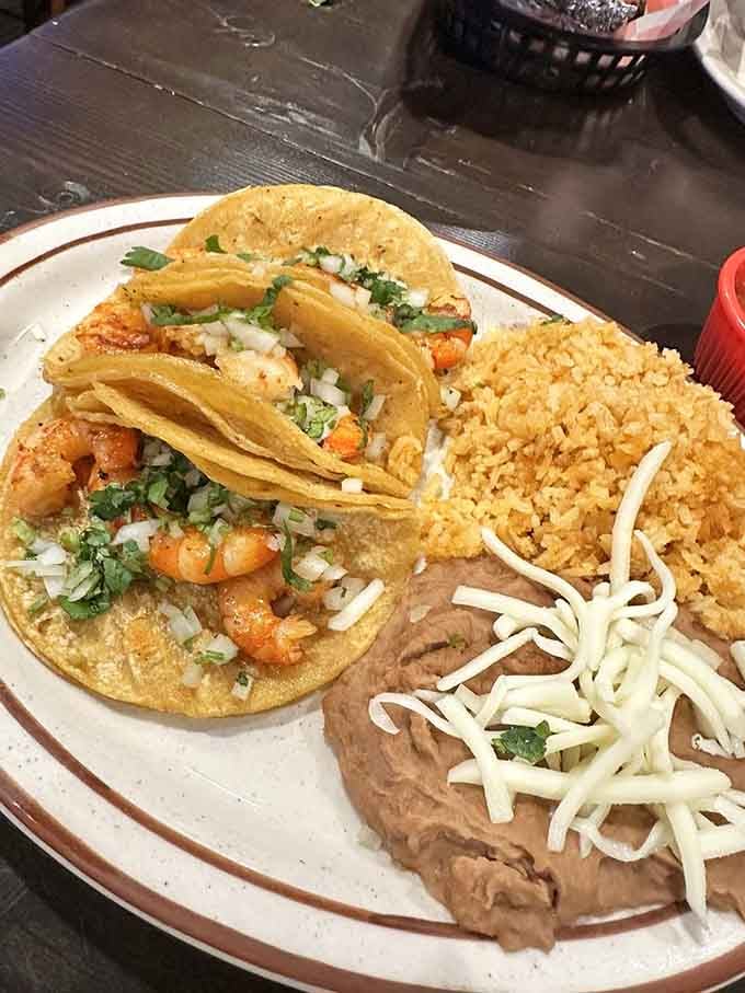 Shrimp tacos on corn tortillas, rice, and beans. Simple, honest, and absolutely impossible to ignore.
