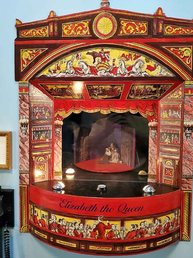 A miniature theater labeled "Elizabeth the Queen" proves that great drama comes in all sizes.