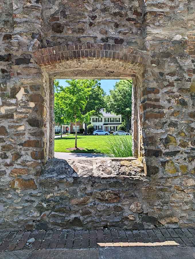 Old stone walls framing a perfectly ordinary neighborhood, which is somehow the most extraordinary thing imaginable.