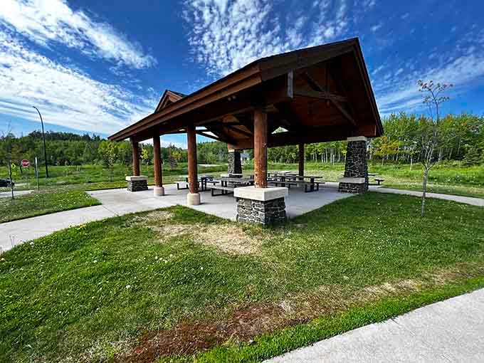 A handsome timber pavilion sits ready under a brilliant blue sky, practically begging you to unpack that picnic basket.