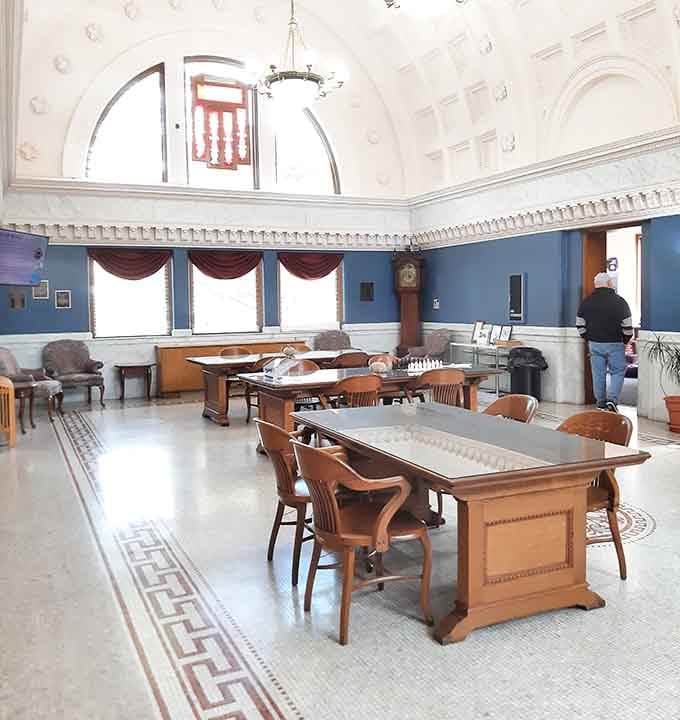 That ornate reading room ceiling makes you wonder if royalty occasionally drops by for story time.