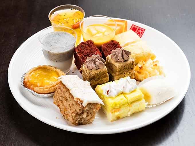 One plate, eleven desserts, zero regrets. This is what peak decision-making looks like in Queens.