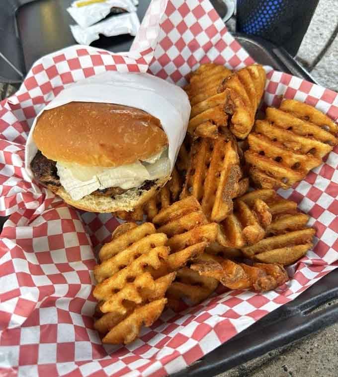 Tucked into a red-checked basket, this turkey burger and waffle fries combo means serious business.