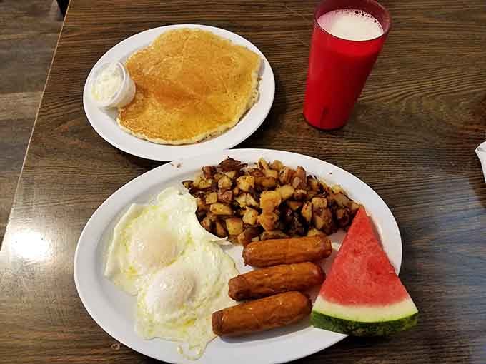 Eggs, sausage links, hash browns, and a pancake that could double as a personal flotation device.