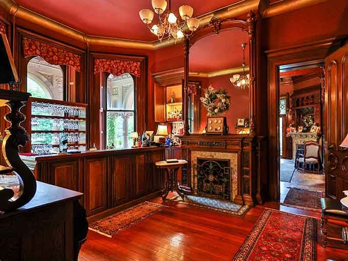 A Victorian bar with a chandelier overhead and a fireplace nearby. Somehow, your living room just got a little less impressive.