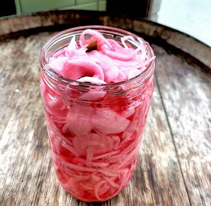 Sweet red onions pickled to perfection, the kind of thing that makes every sandwich feel like a special occasion.