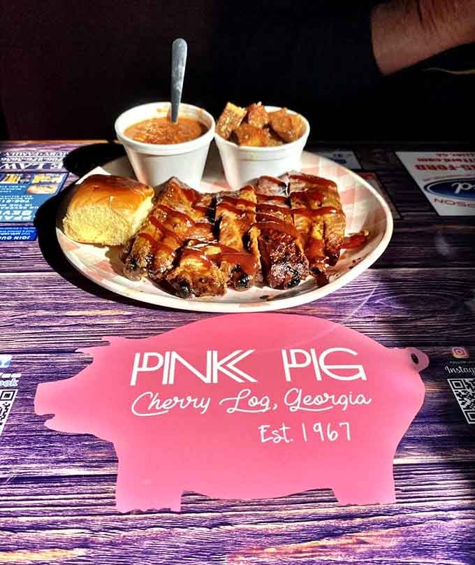 Pit-cooked ribs glazed and glistening, the kind of plate that makes you forget you ever had table manners.