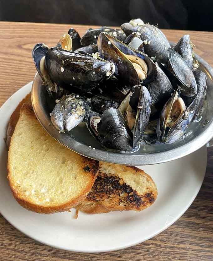 Penn Cove mussels in garlic butter broth with toasted bread, because some things in life are just perfect.
