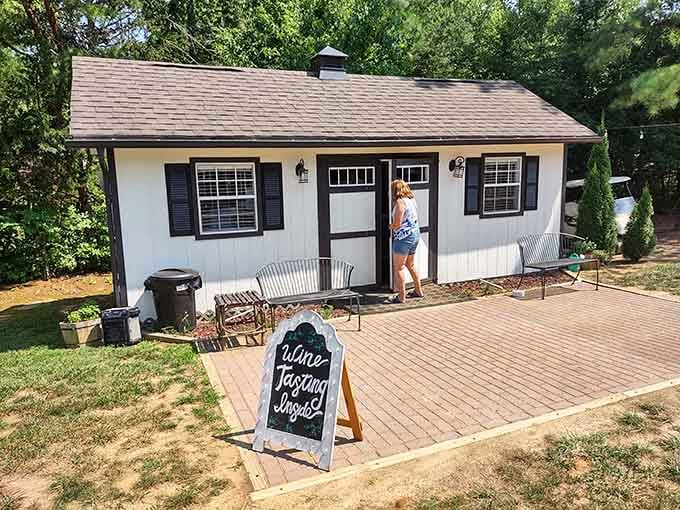 That chalkboard sign reading "Wine Tasting Inside" outside this charming cottage is the most persuasive two-word invitation you'll ever receive.