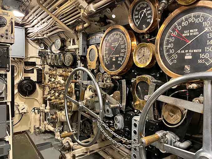 Brass gauges, hand wheels, and depth readings that once meant everything: this control room ran on nerves and precision.