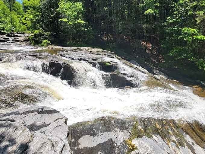 Sunlight hits the cascading tiers just right, turning ordinary rock and water into something genuinely spectacular.