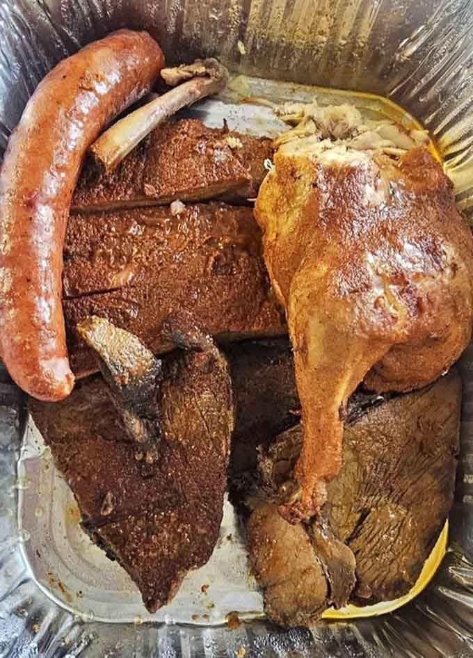 Ribs, sausage, and smoked chicken piled together, this BBQ sampler is basically a greatest hits album you can eat.